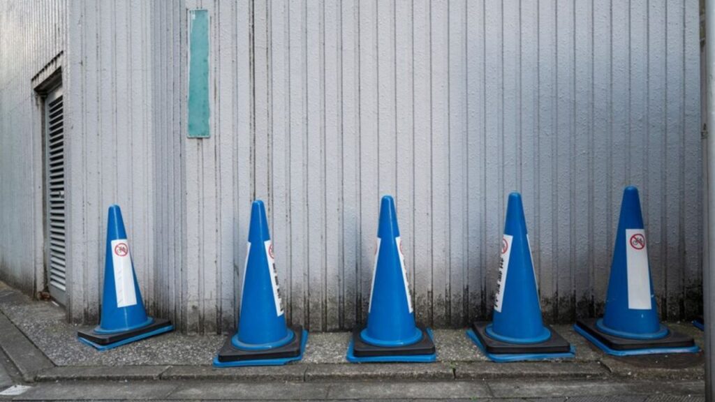 Small clear cone shaped bump stops for hood deflector